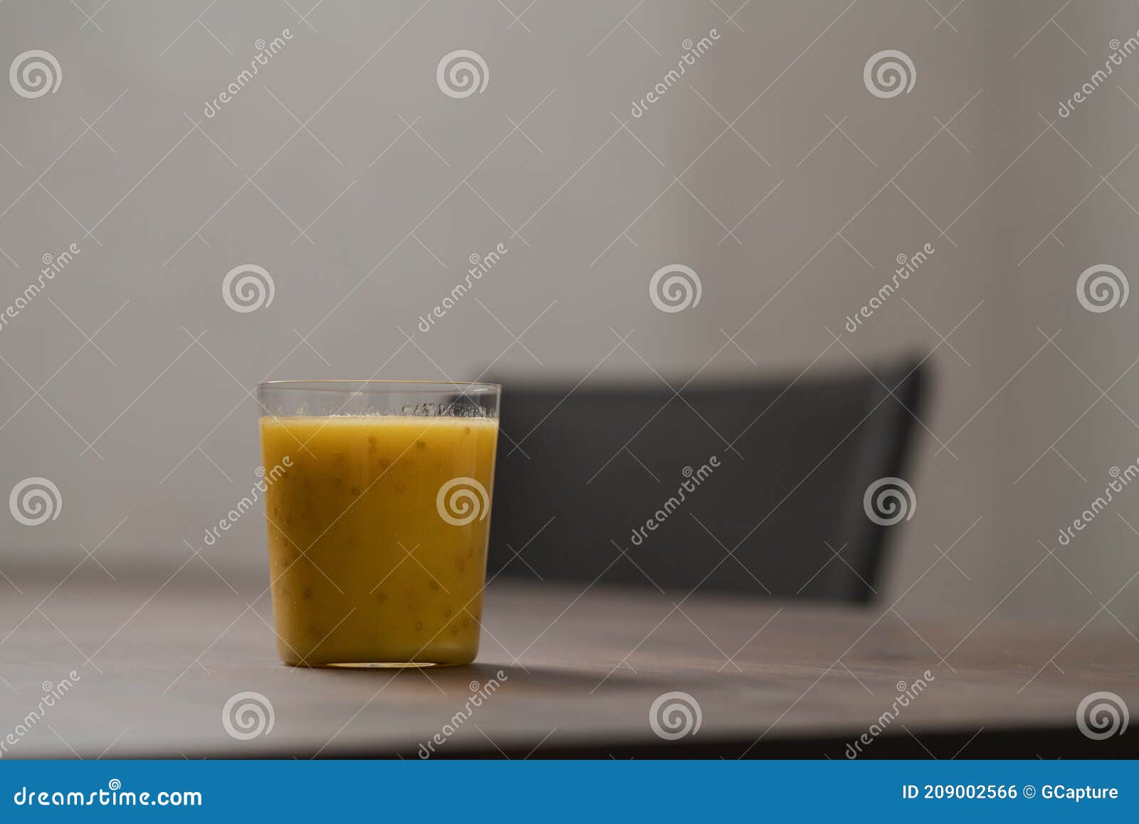 Mango Lulo Smoothie on Walnut Wood Table with Copy Space Stock Photo ...