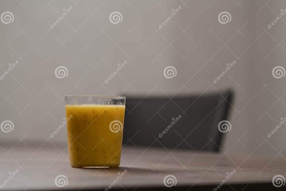 Mango Lulo Smoothie on Walnut Wood Table with Copy Space Stock Photo ...