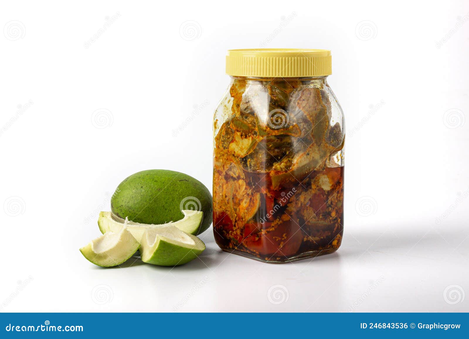Mango Pickle Jar with Pieces of Raw Green Mangoes on White Background ...