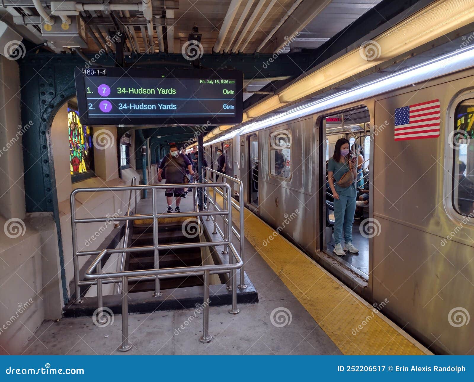 Subway Platform with 7 Train in the Station, Passengers Exit the Train ...