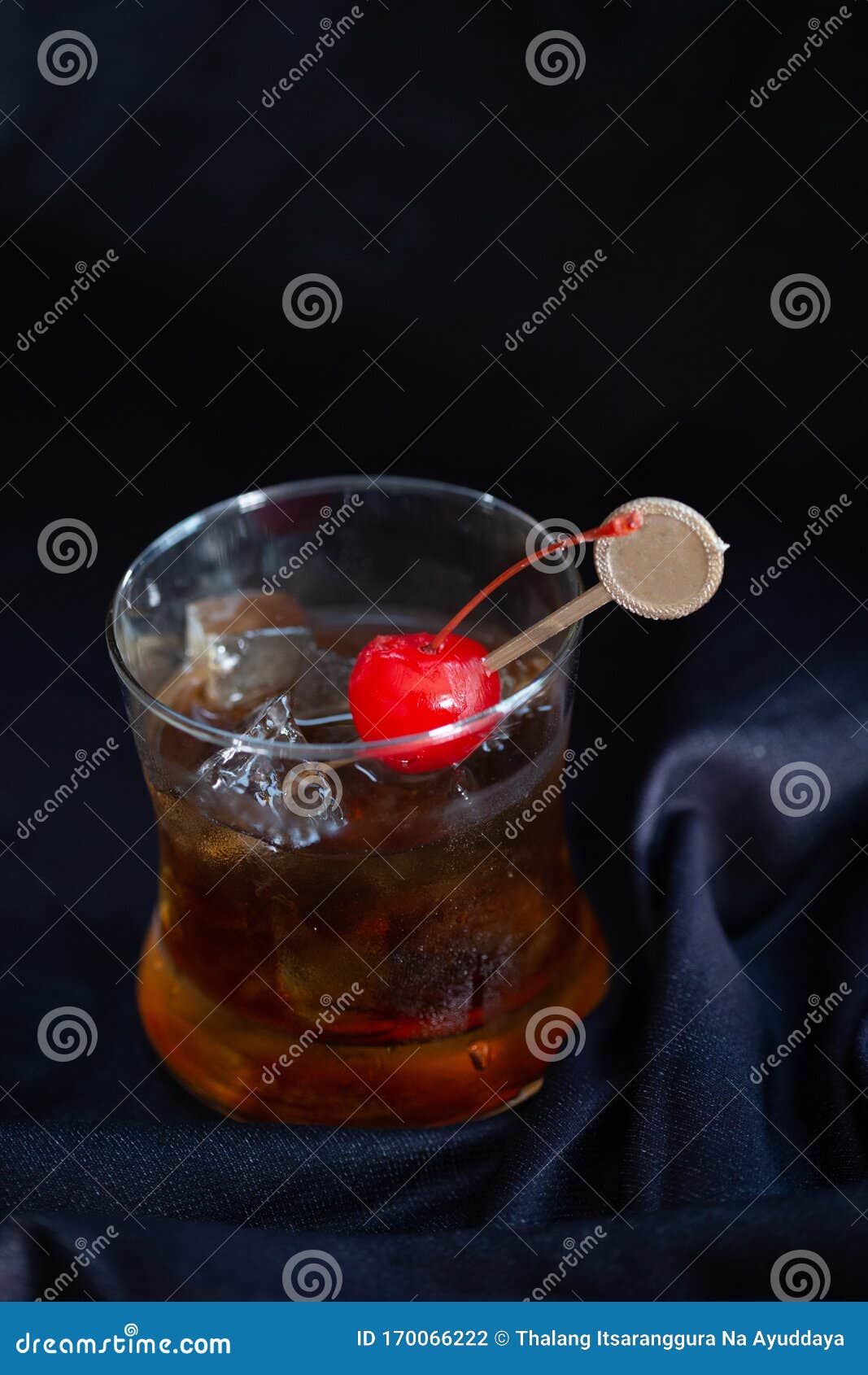 Manhattan with a Cherry Garnish.Black Cloth Backdrop Stock Photo ...