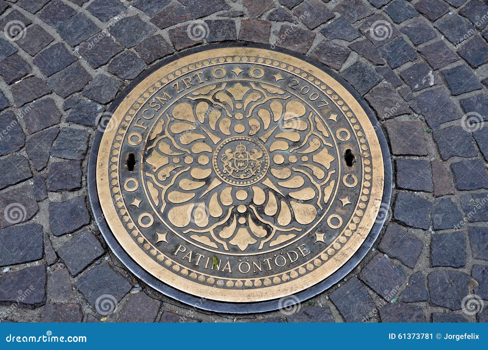 Manhole cover in brass stock image. Image of manhole - 61373781