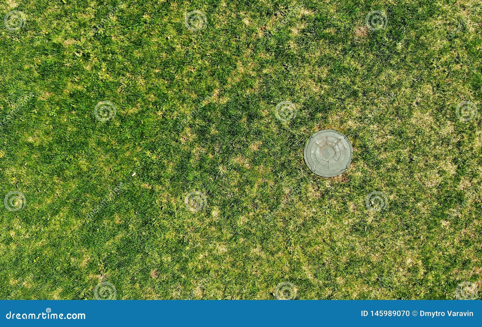Manhole Cover in a Green Grass Lawn, Top View. Stock Photo - Image of ...