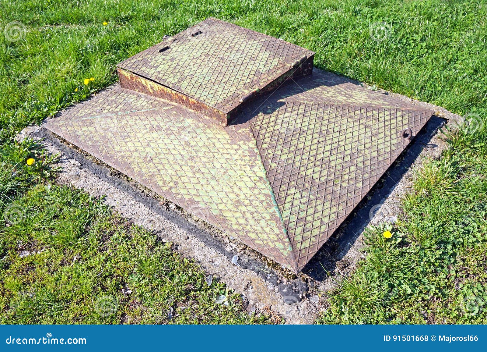 Manhole cover in the park stock photo. Image of grass - 91501668