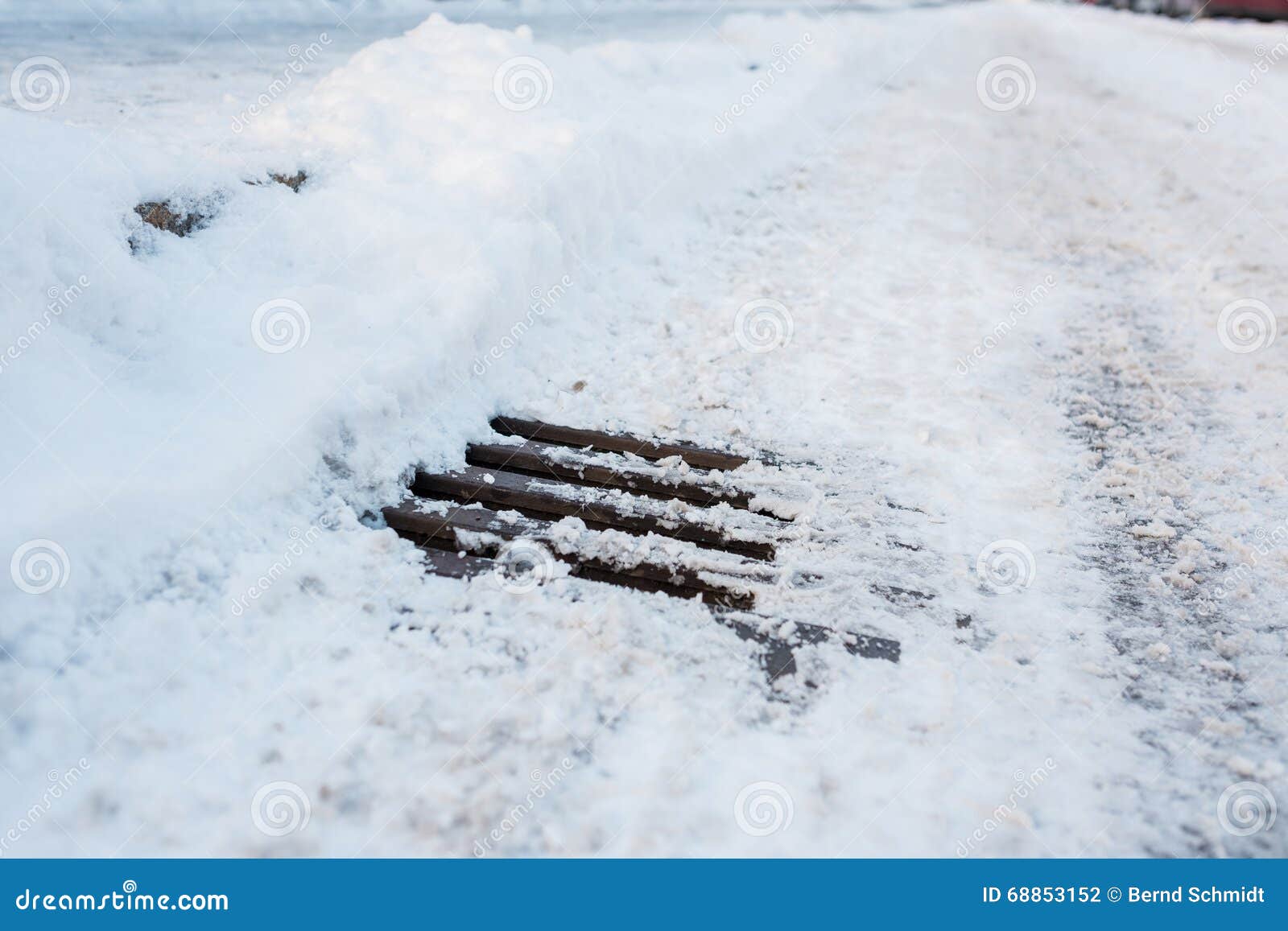 Manhole Cover and Road with Snow Stock Photo - Image of tracks, white ...