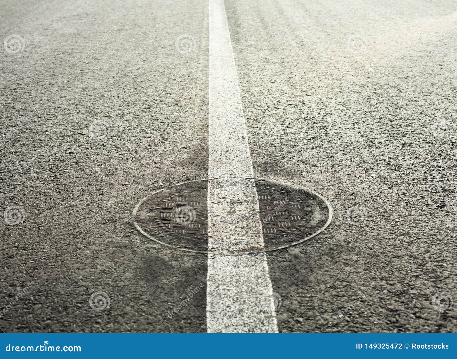 Manhole cover on the road stock photo. Image of close - 149325472