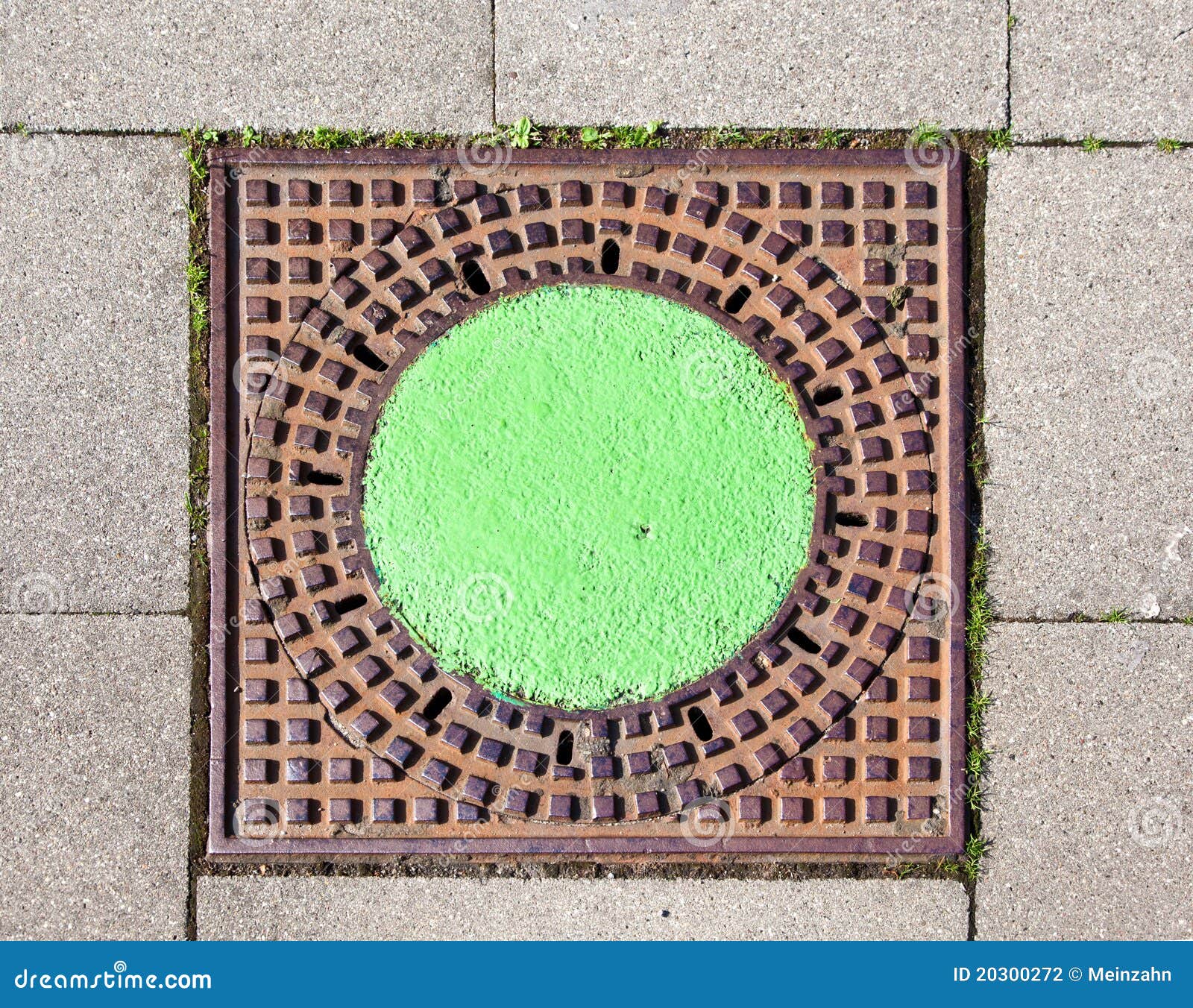 A Manhole Cover in the Street Stock Photo - Image of bricks, cover ...
