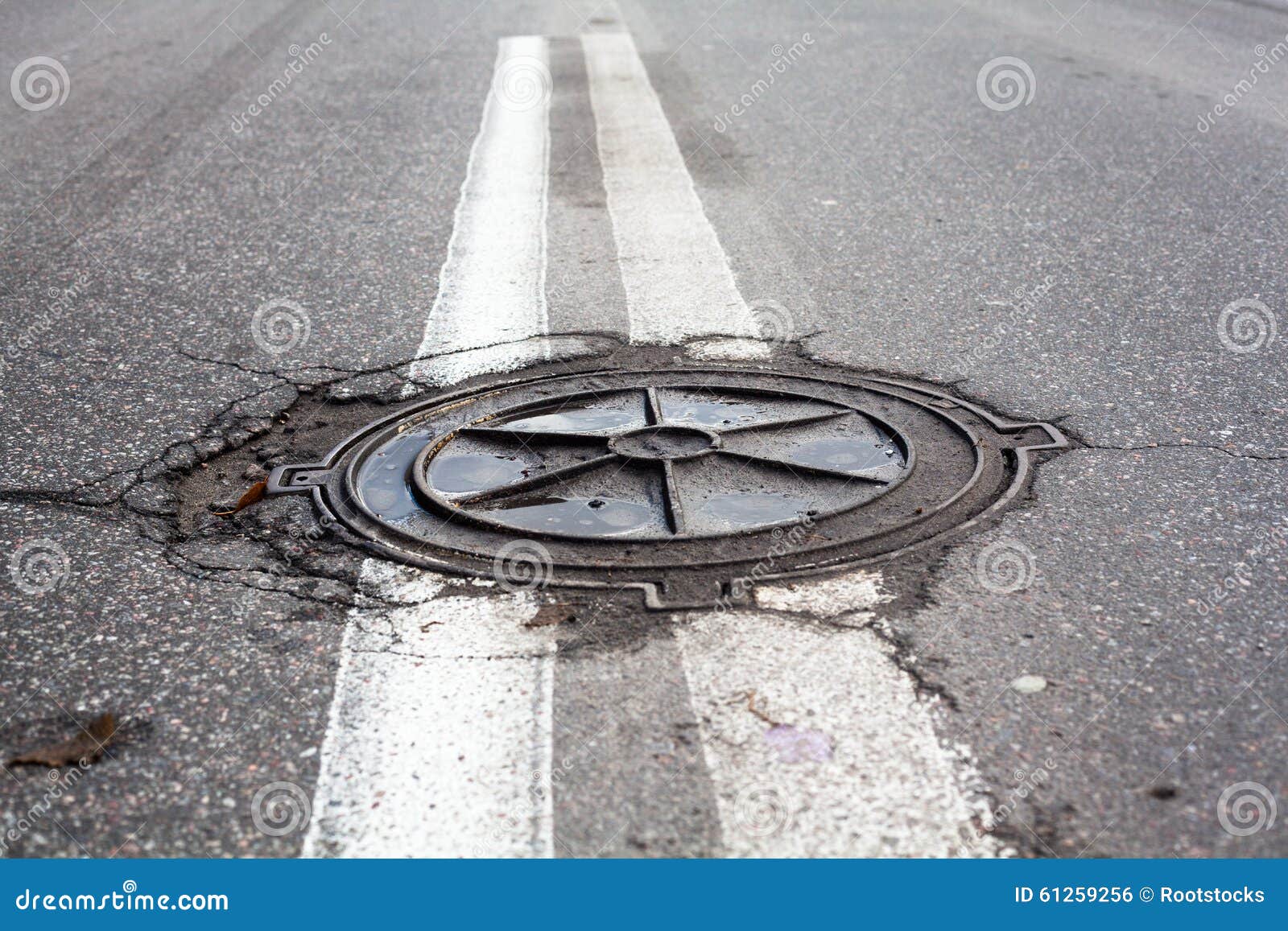 Manhole on the road stock photo. Image of concrete, marking - 61259256