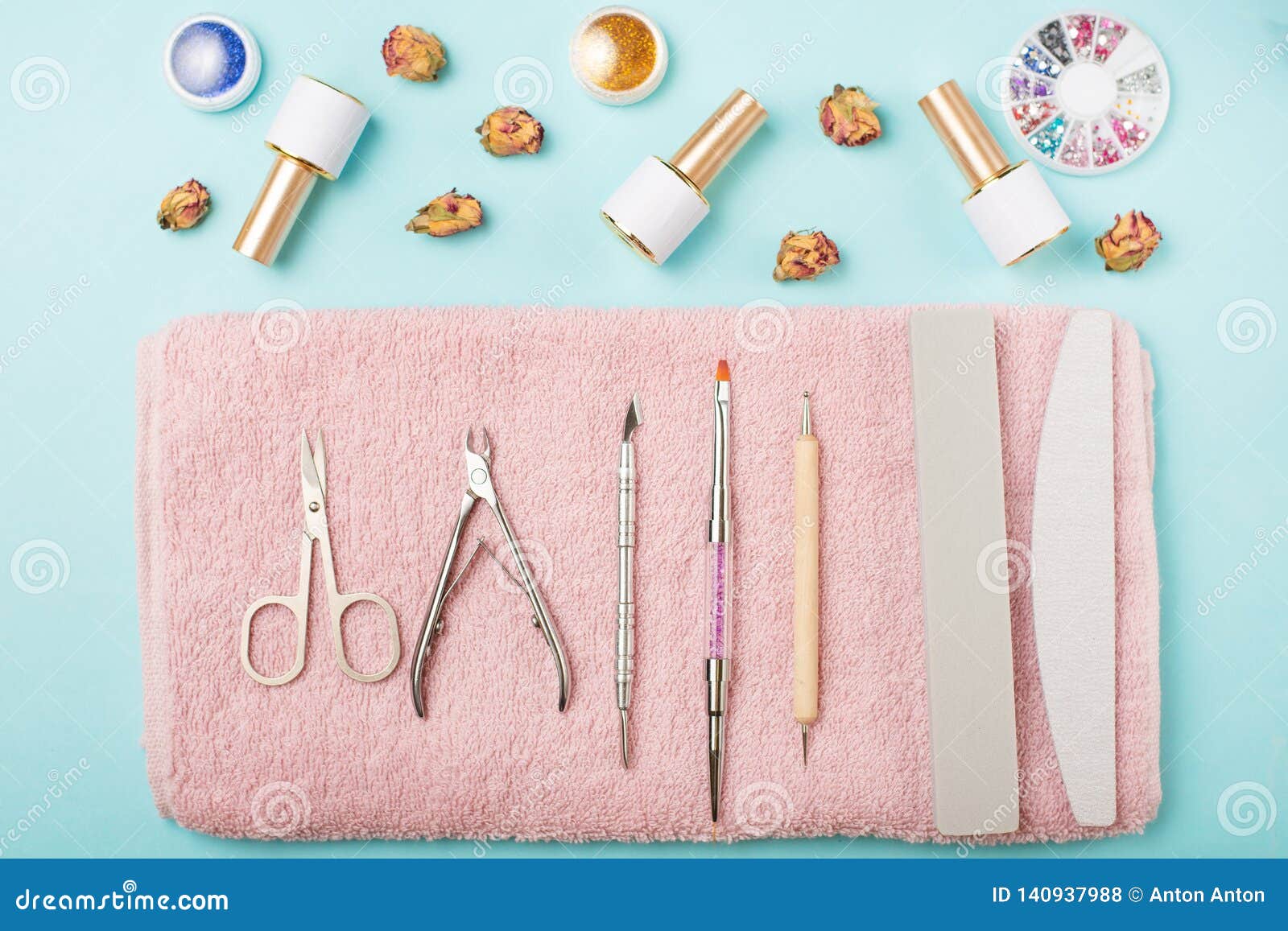 Manicure Tools on a Pink Towel and a Blue Background. Manicure ...