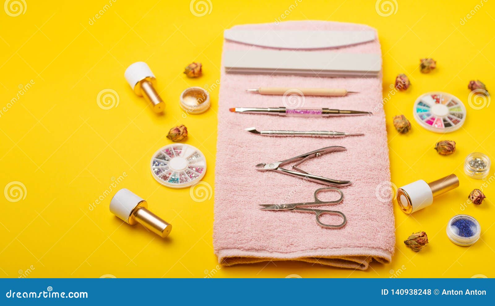 Manicure Tools on a Pink Towel and a Yellow Background. Manicure ...