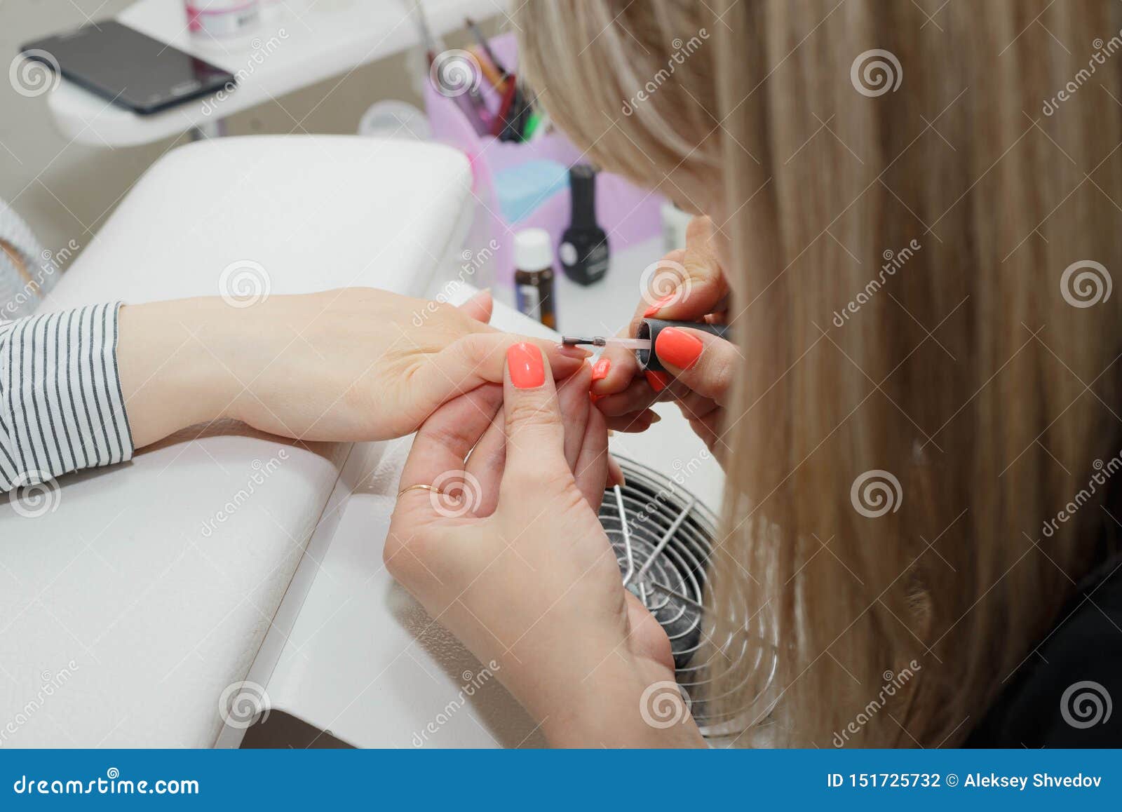 Manicuring Nails - Application of Base Coat. Nail Master Stock Photo ...