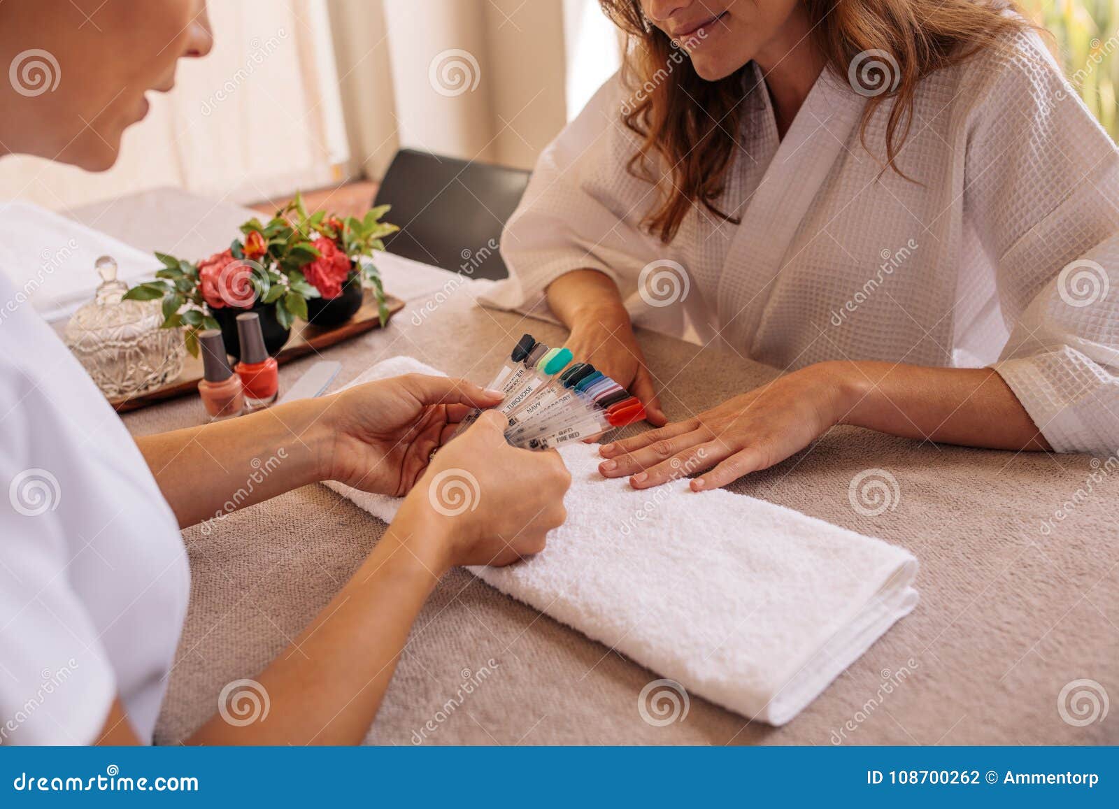 Manicurist Displaying Samples of Nail Patterns To Client Stock Photo ...