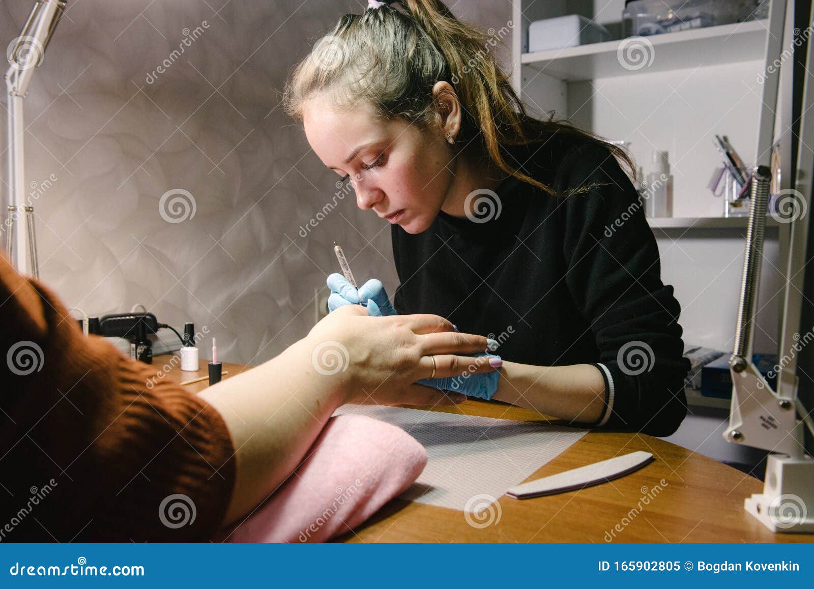 Manicurist Makes Hardware Manicure Close-up. Treatment of Nails with ...