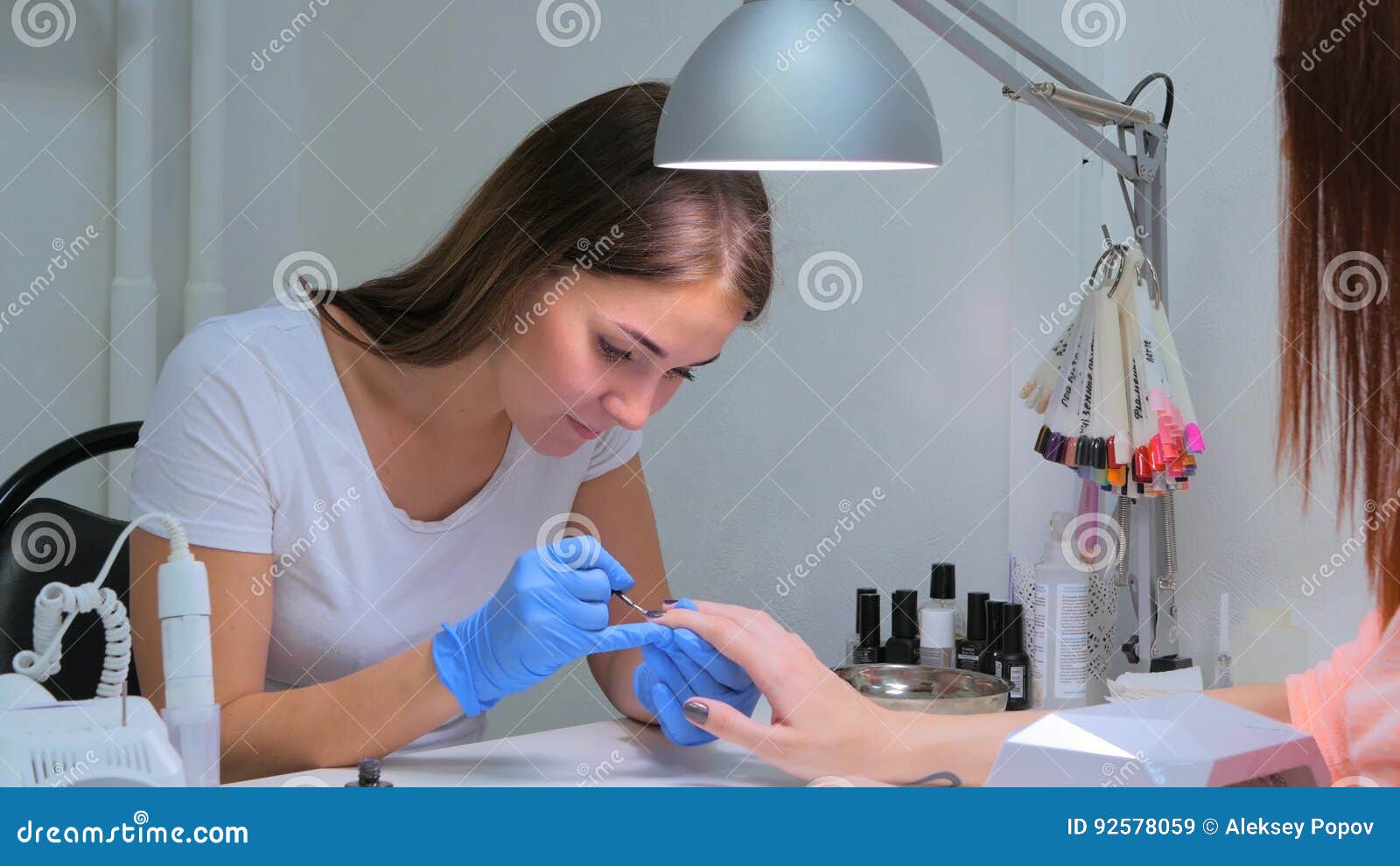 Manicurist Master Makes Manicure Stock Image - Image of girl, painting ...