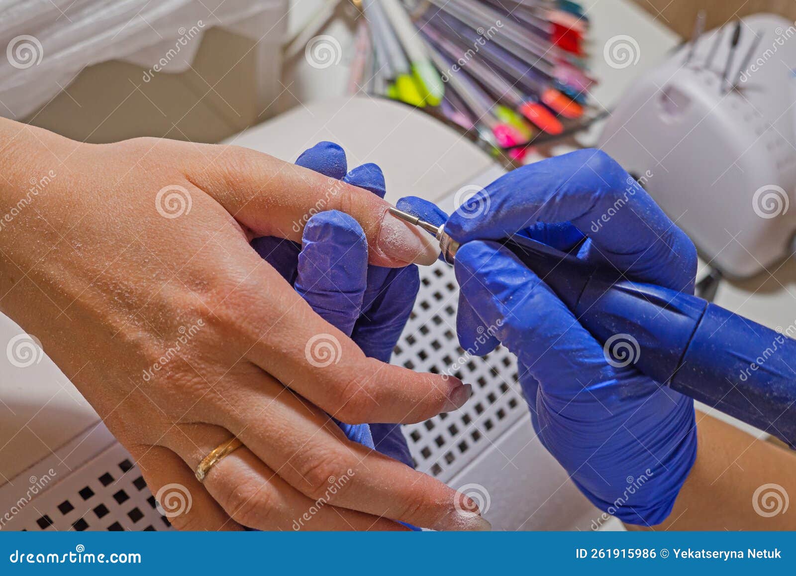 Manicurist Master Removing Cuticles. Medical Hardware Manicure in a ...