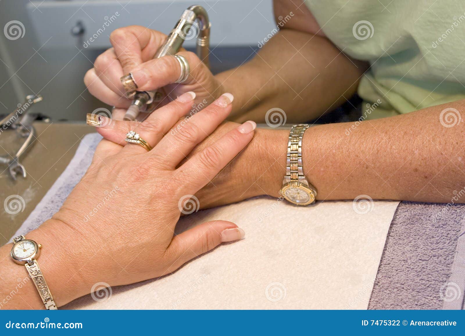 Nail Technician Giving Customer A Manicure Royalty-Free Stock Photo ...