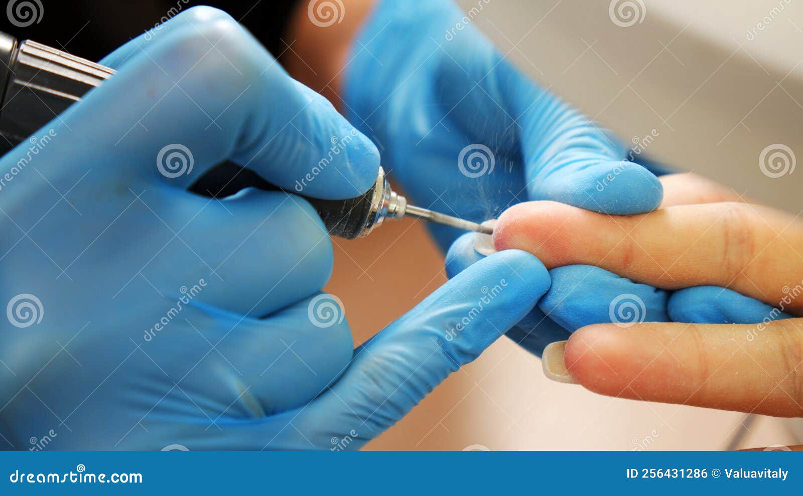 Manicurist in Process of Removing Gel Polish or Acrylic from Nails ...
