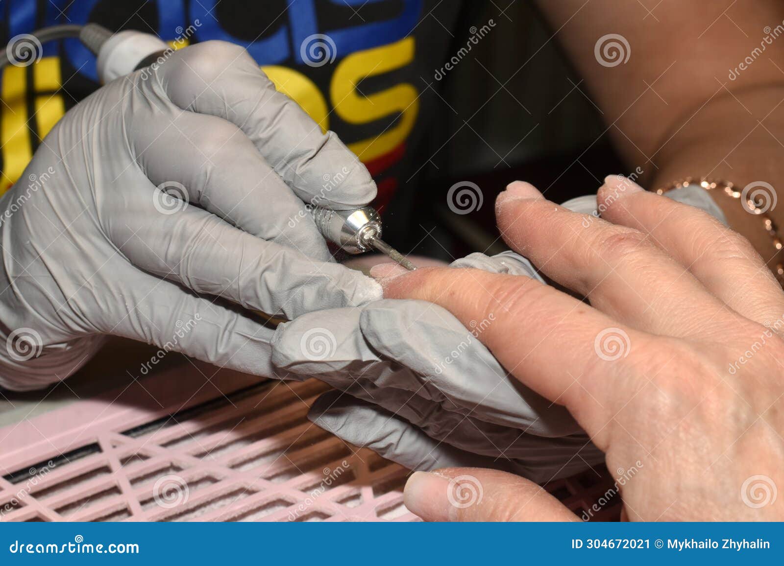 A Manicurist Works with a Client Using a Milling Cutter. Stock Image ...