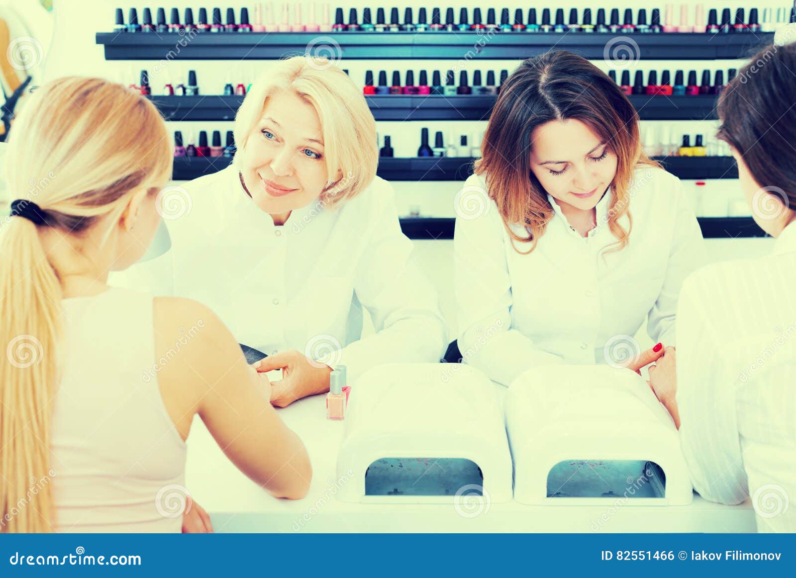 Manicurists Doing Nails To Clients Stock Photo - Image of precision ...