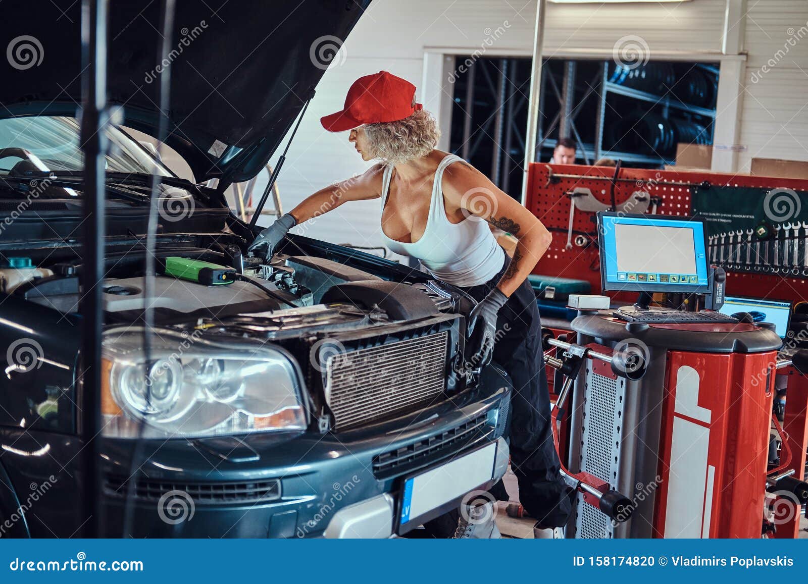 Professional Female Worker is Fixing Car Stock Photo - Image of curly ...