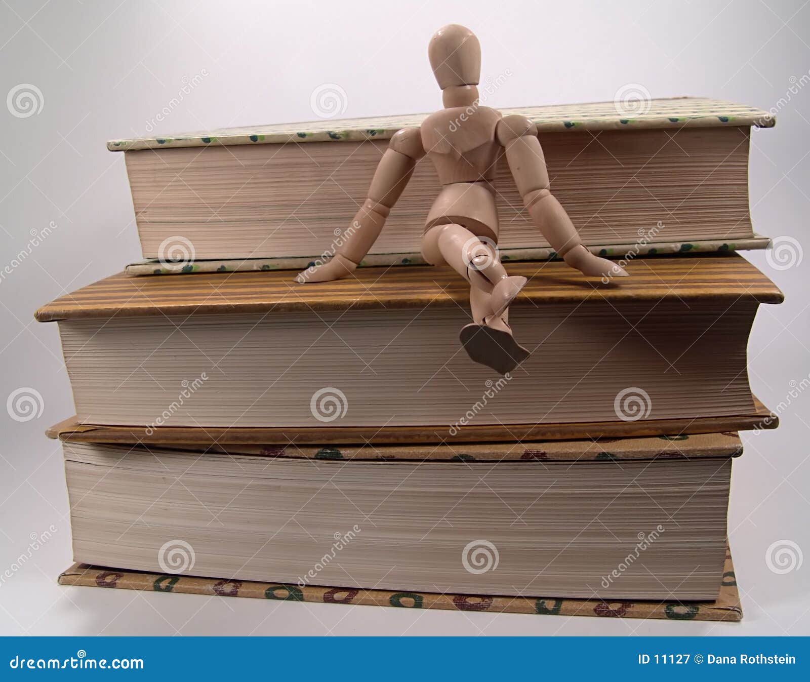 Mannequin Sitting on Books stock image. Image of books, pages - 11127