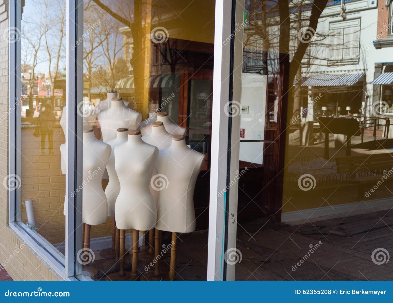Mannequins in Empty Store Front Stock Photo - Image of shop, storefront ...