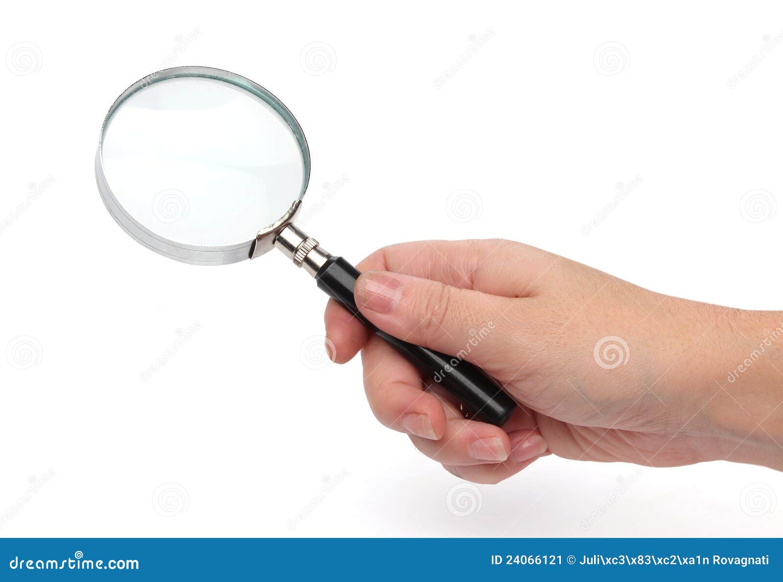 Mano que sostiene una lupa imagen de archivo. Imagen de mano - 24066121
