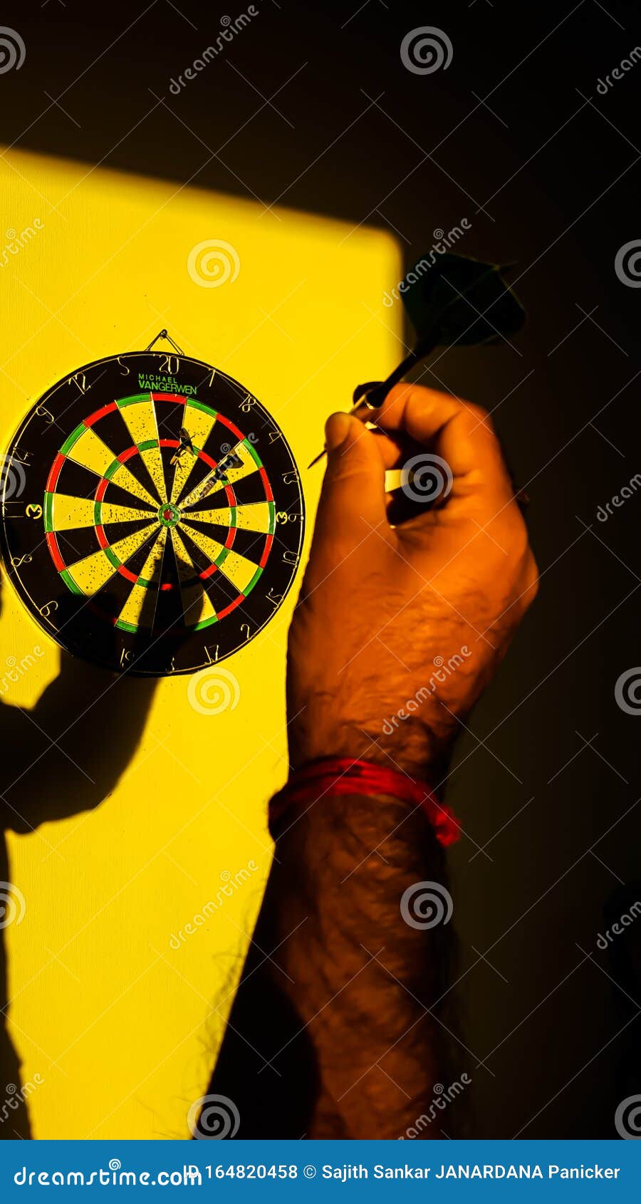 Mans Hand is Aiming at a Dart Board Stock Photo - Image of dartboard ... Mans Hand is Aiming at a Dart Board Stock Photo - Image of dartboard ...