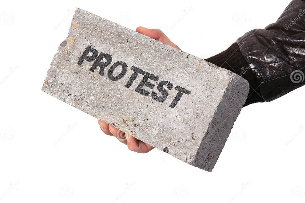 A mans hand holding brick stock photo. Image of radical - 38254812