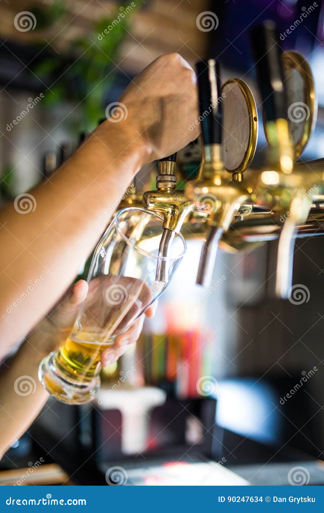 Mans Hand Pouring Pint of Beer Behind the Bar in Pub Stock Photo ...