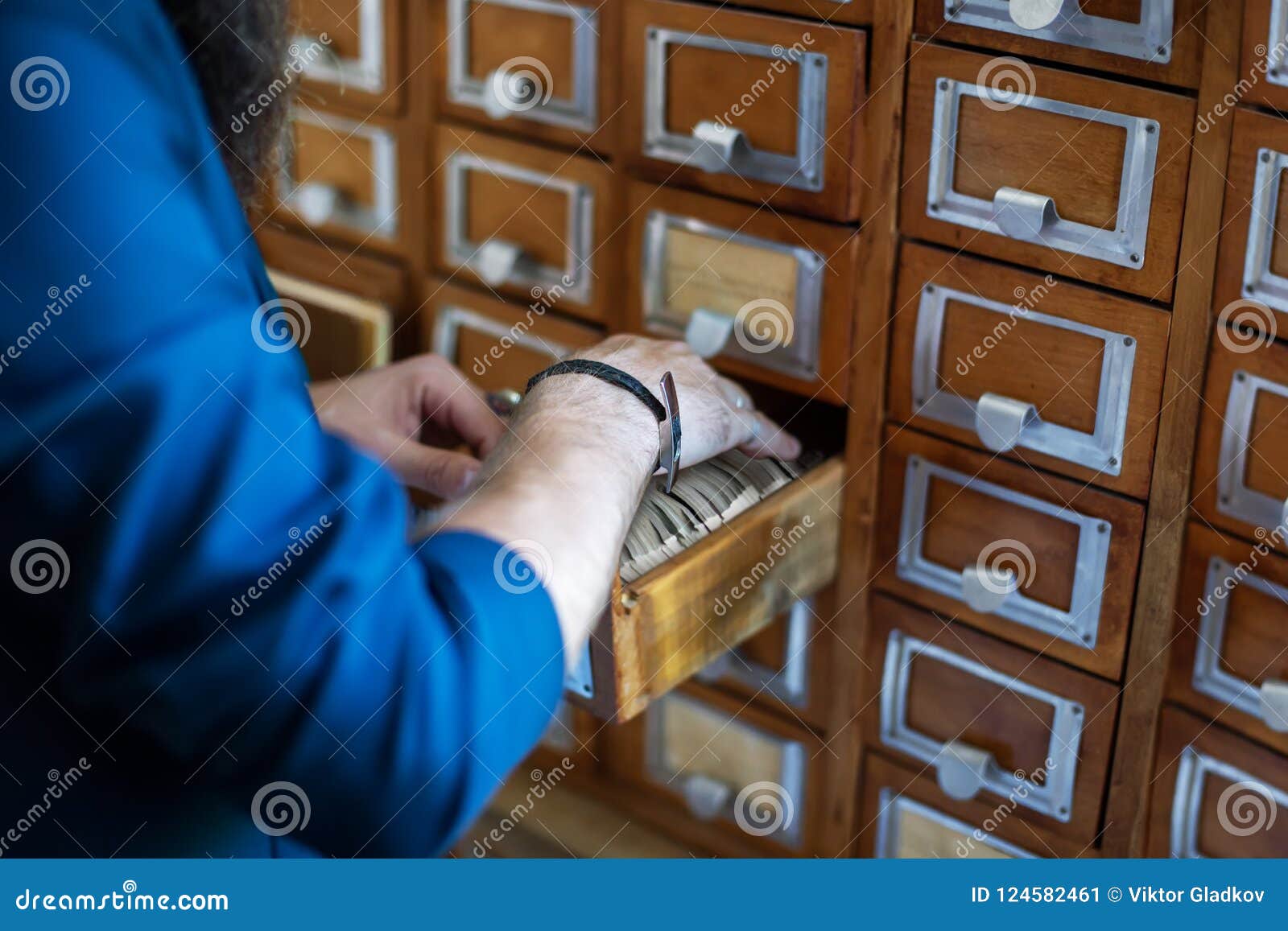 Mans Hand Searching for Files into Library or Archive Stock Image ...