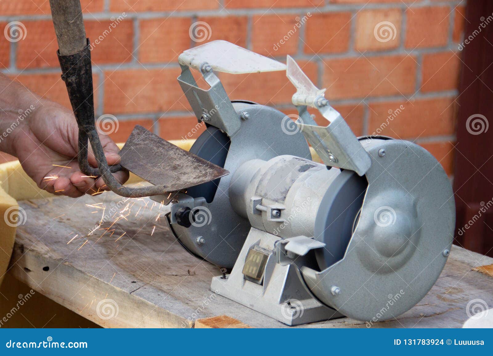 Mans Hand Sharpens a Hoe on Electric Grindstone in Rural Shed Stock ...