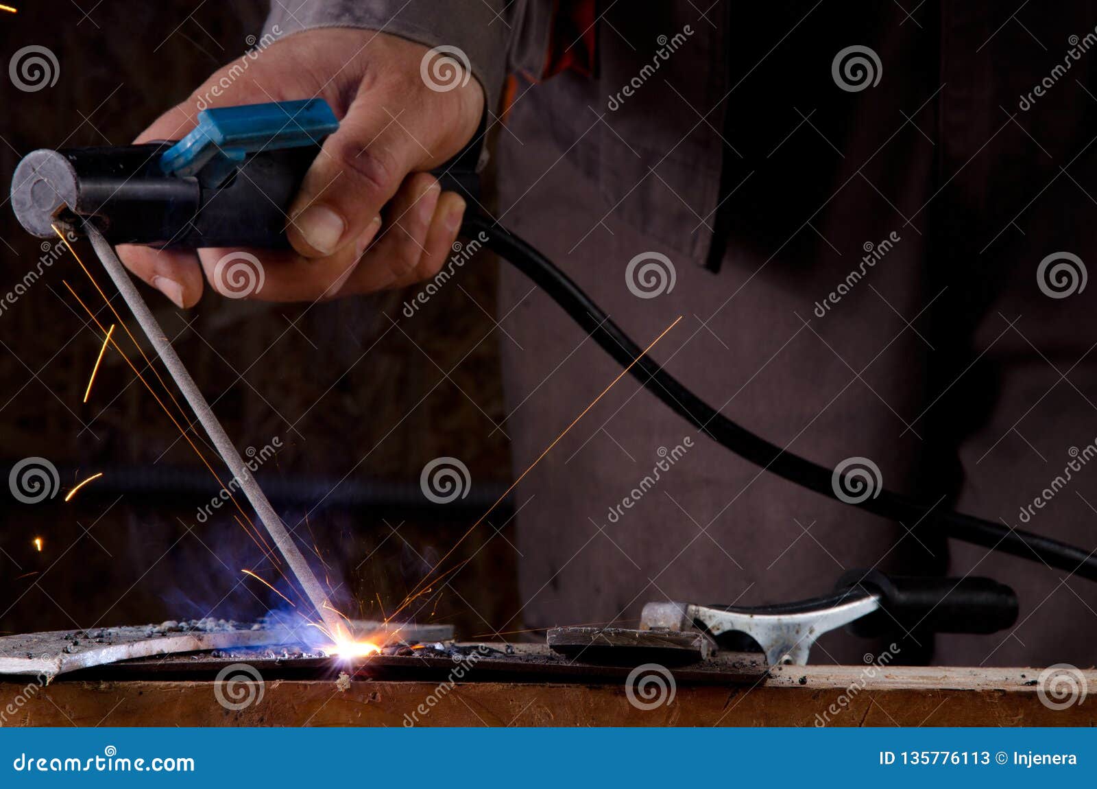 Mans Hand with Welding Machine Stock Image - Image of shiny, iron ...