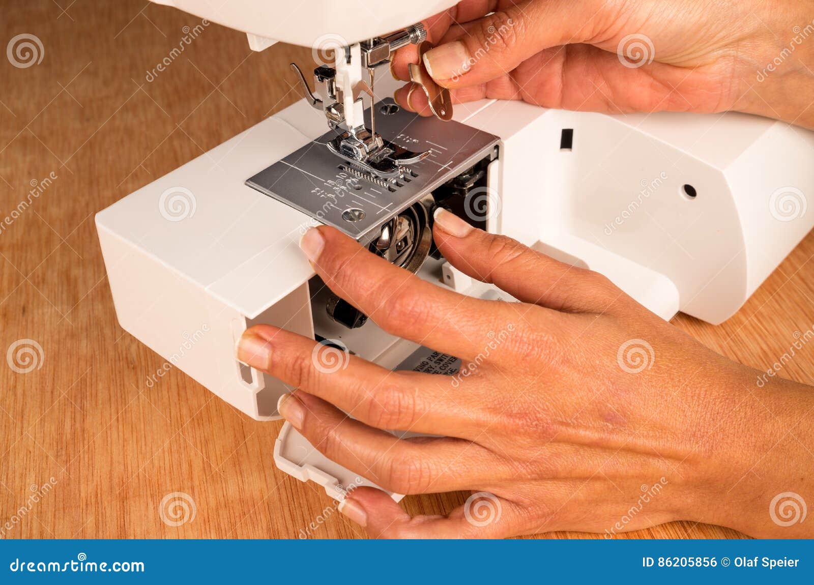 Mantainance of a Sewing Machine Stock Photo - Image of holding ...