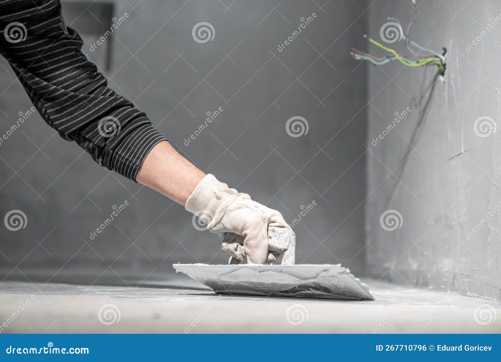 Manual Application of Waterproofing on the Floor on the Construction ...