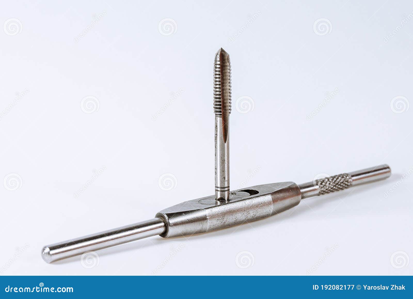 Manual Tap for Cutting Threads in Metal on a White Background. Metal ...