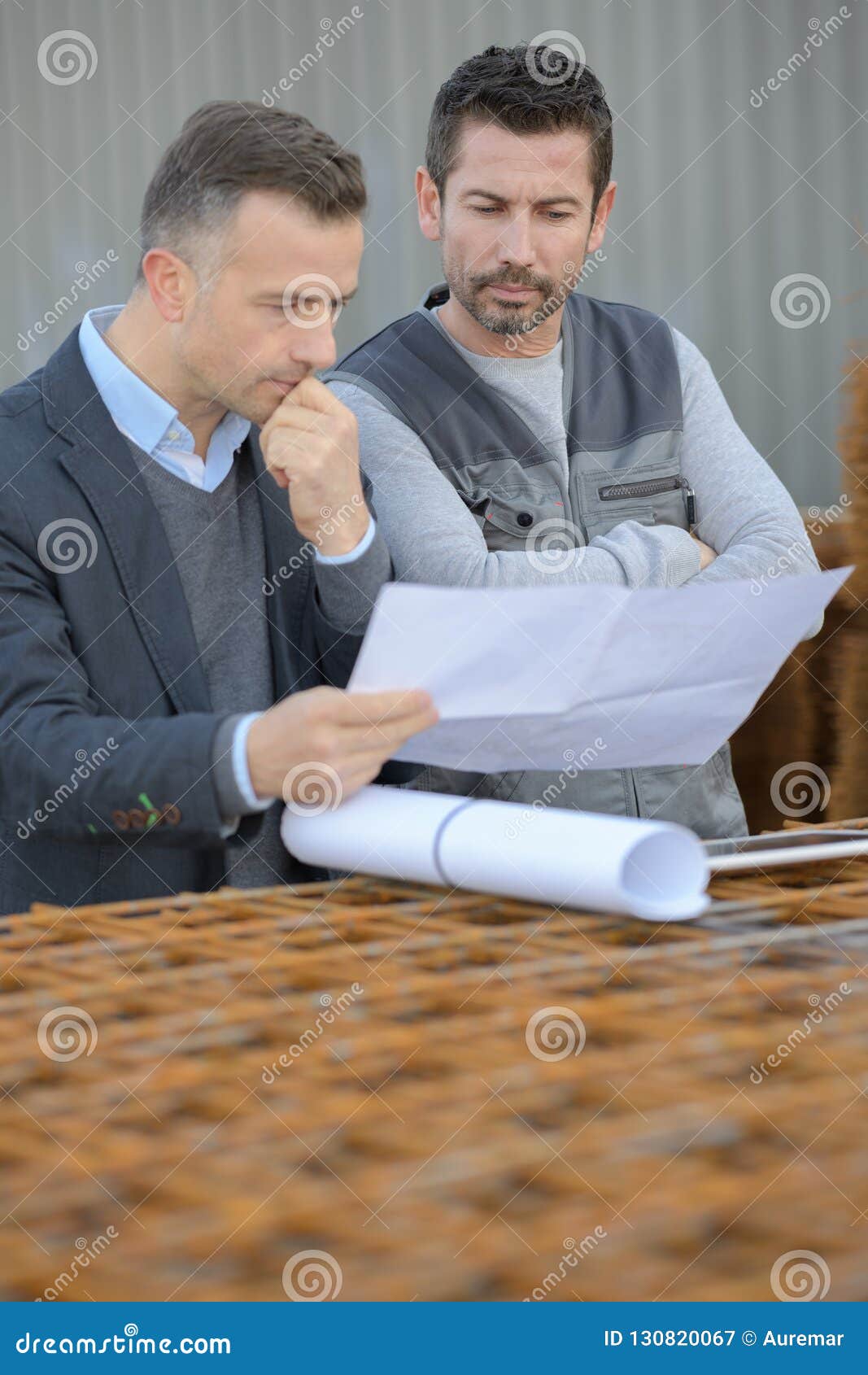 Manual Worker and Businessmen with Clipboards Outside Warehouse Stock ...