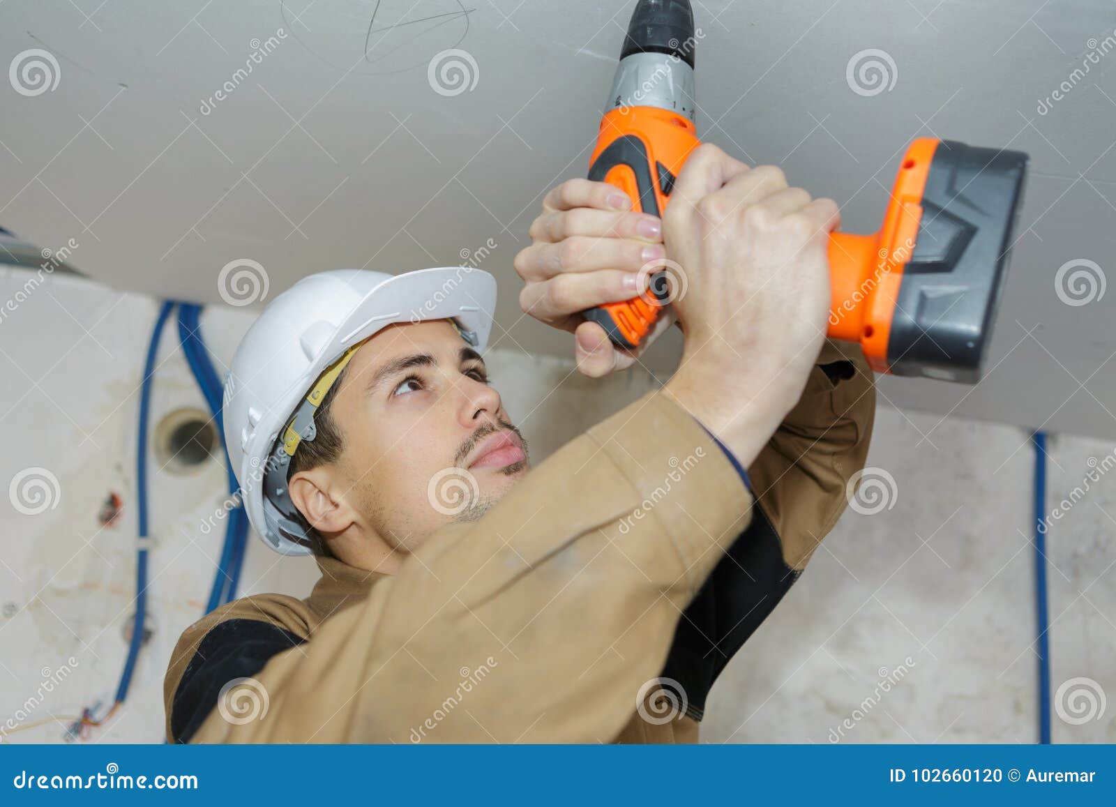 Manual Worker Drilling Ceiling with Drilling Machine Stock Photo ...