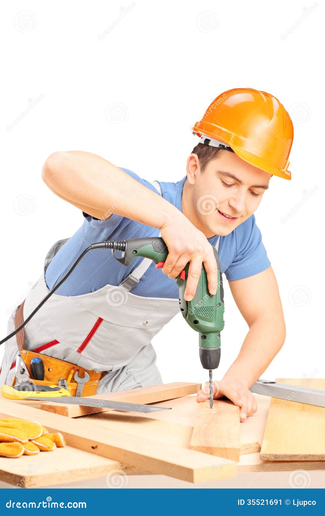 Manual Worker Drilling with a Hand Drilling Machine in a Workshop Stock ...