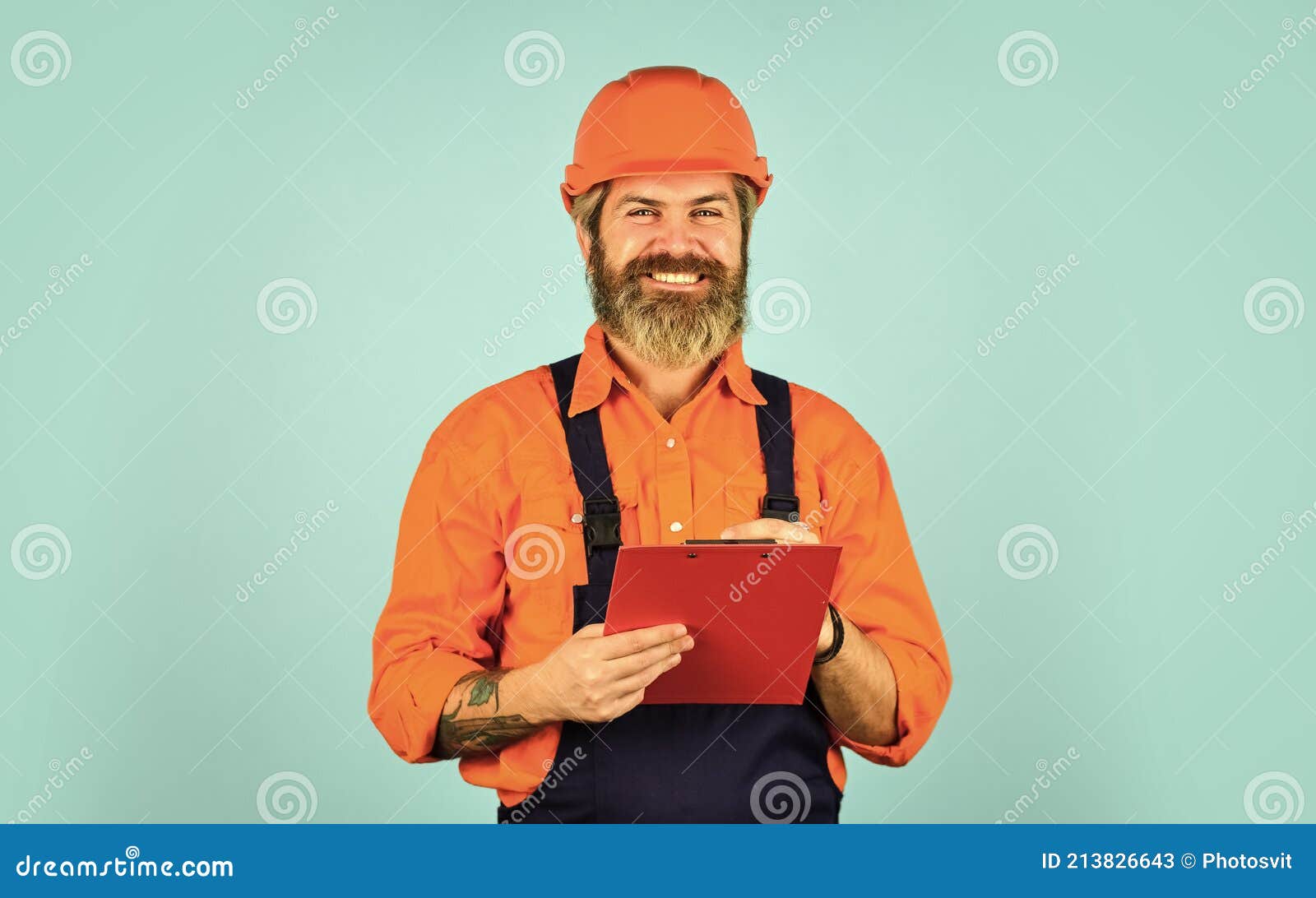 Manual Worker in Helmet. Worker with the Folder in Construction Uniform ...