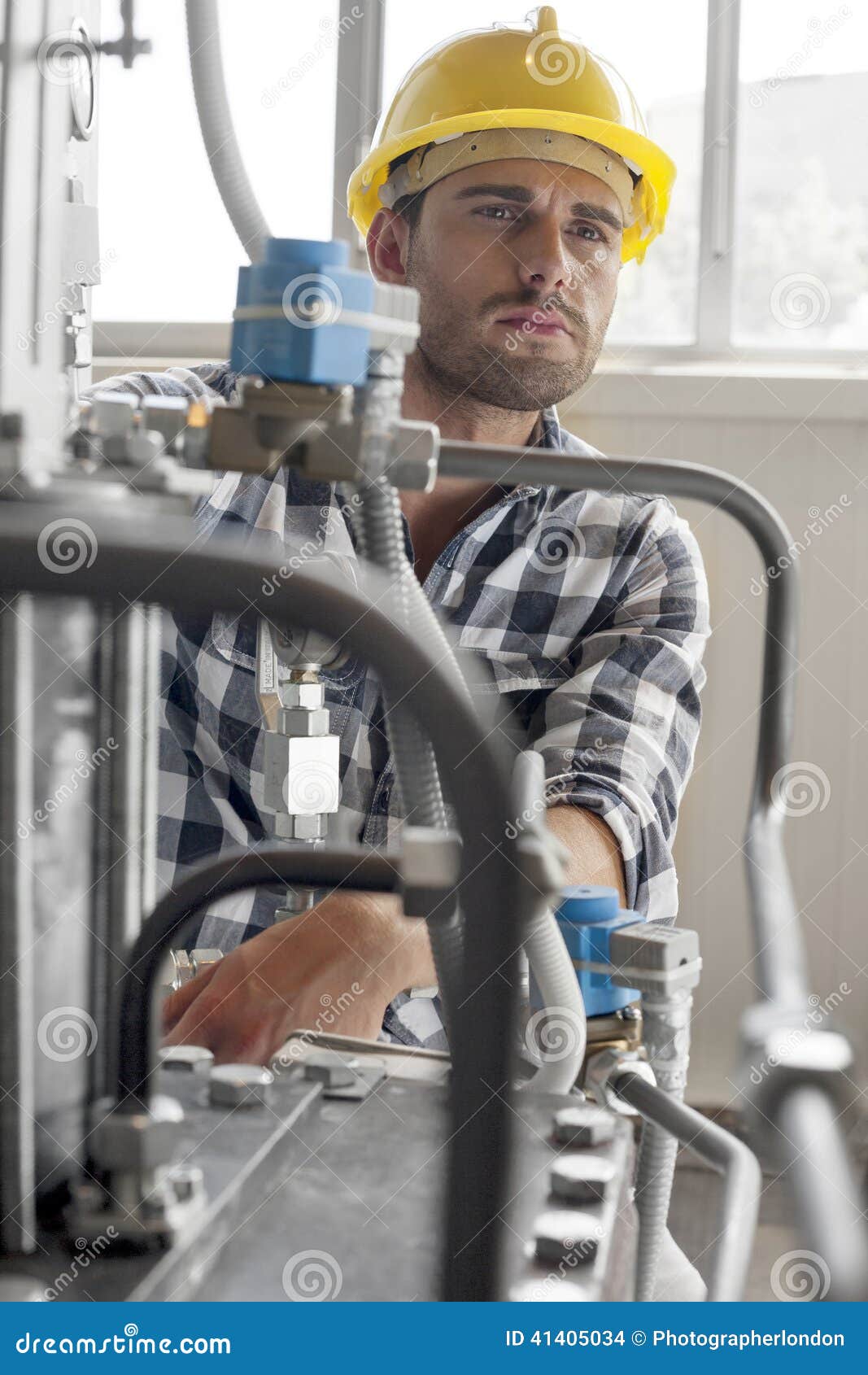 Manual Worker Looking Away while Examining Machine in Industry Stock ...