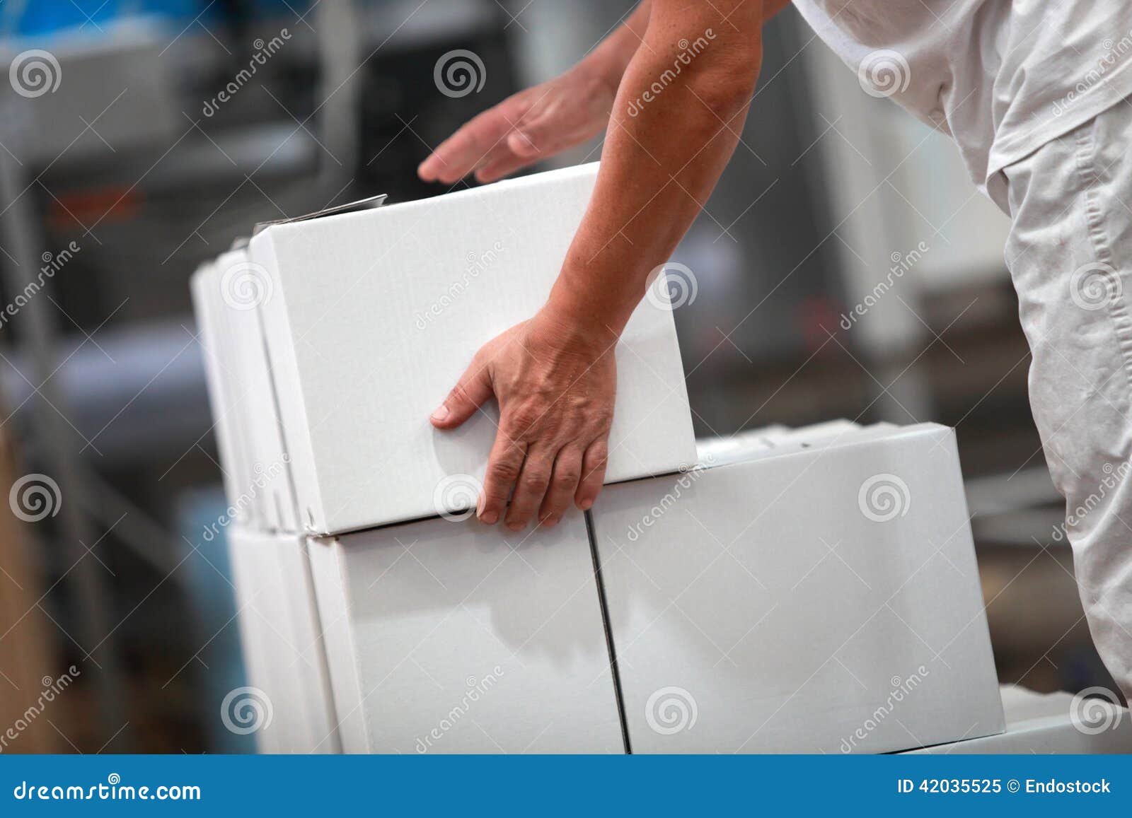 Manual Worker at Production Line Dealing with Boxes Stock Image - Image ...