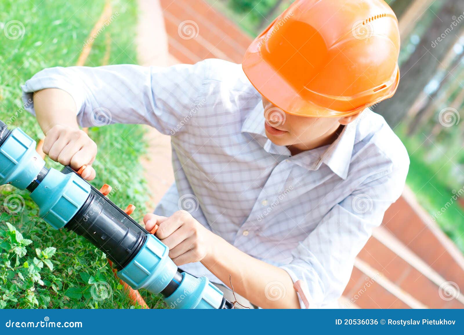Manual Worker Repairing a Pipe Stock Photo - Image of horizontal, happy ...