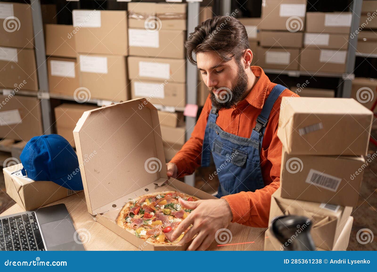 Manual Worker in Uniform Holding Delicious Pizza during Lunch at ...