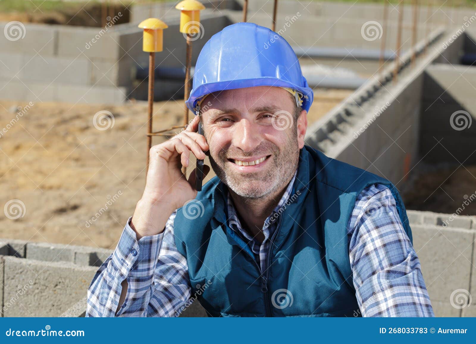 Manual Worker Using Phone in Construction Site Stock Image - Image of ...