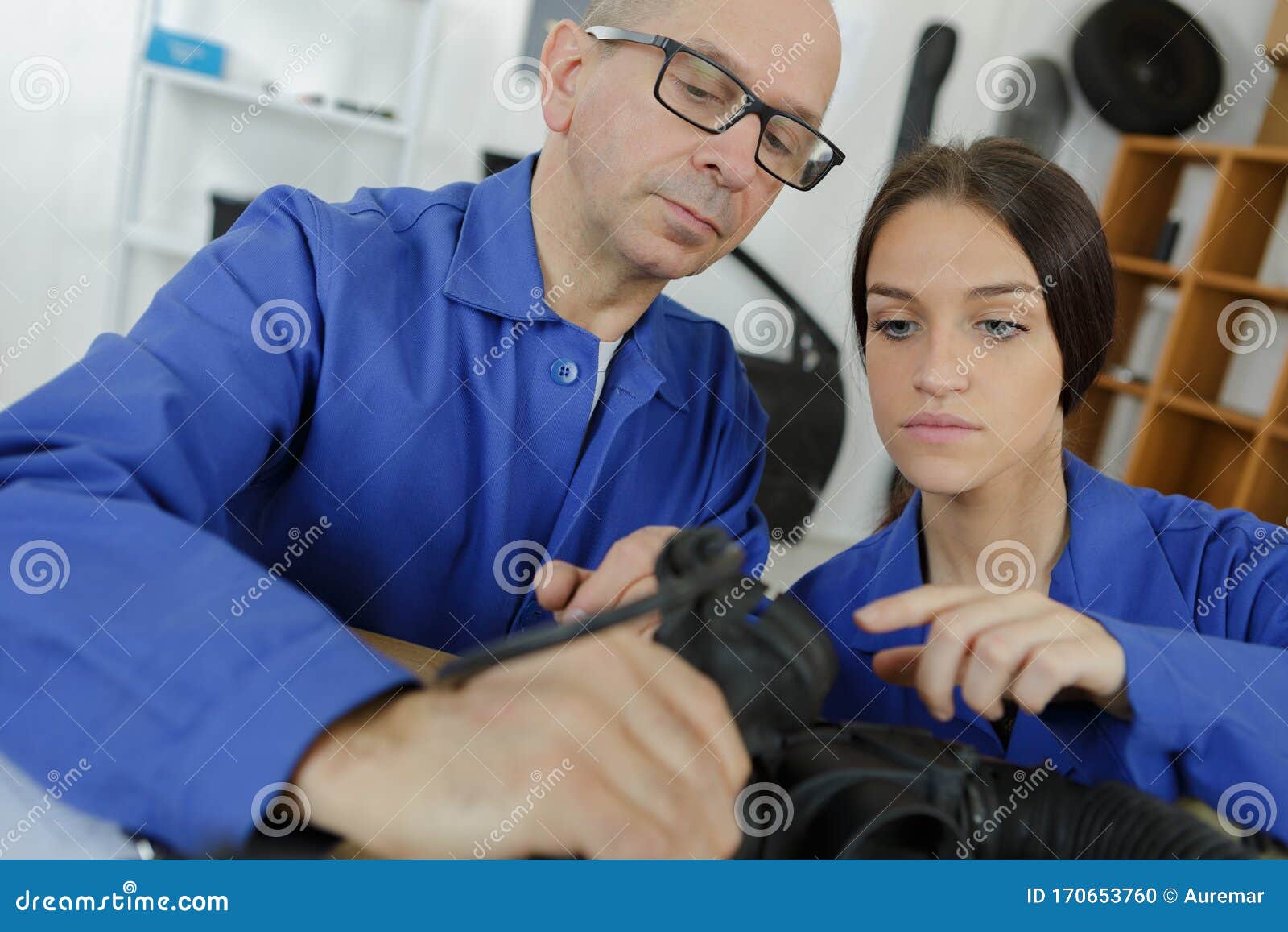 Manual Workers Inspecting Rubber Parts Stock Photo - Image of worker ...