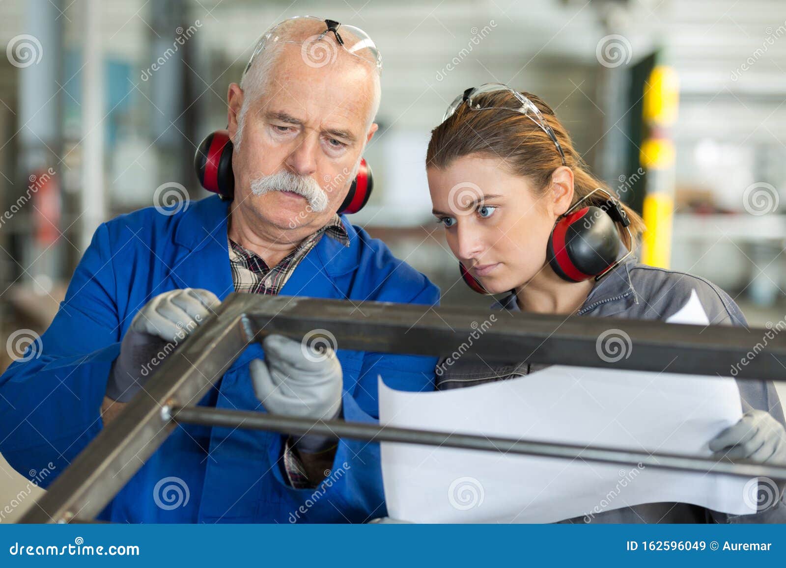 Manufacture Workers Working on Electronic Machine Stock Image - Image ...