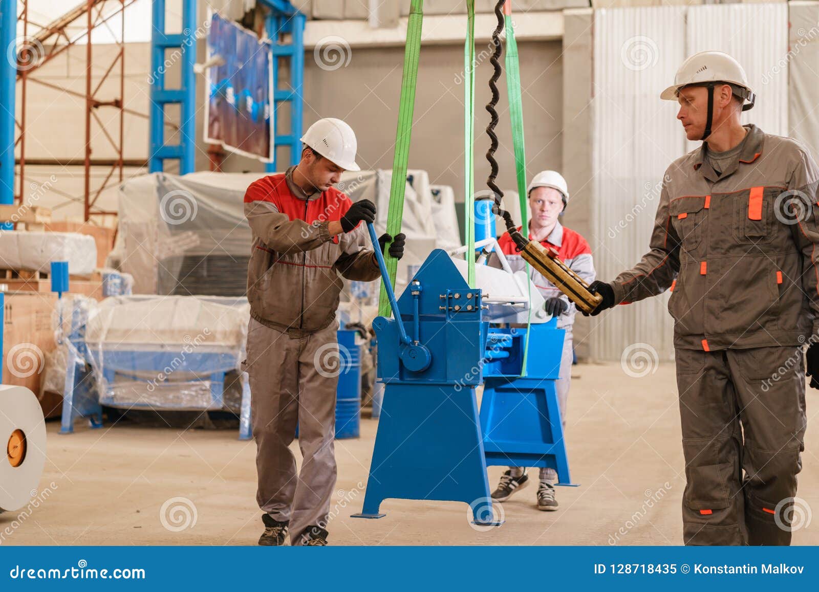 Manufacture Workshop. Move the Crane with Beam. Workers Adjusts the ...