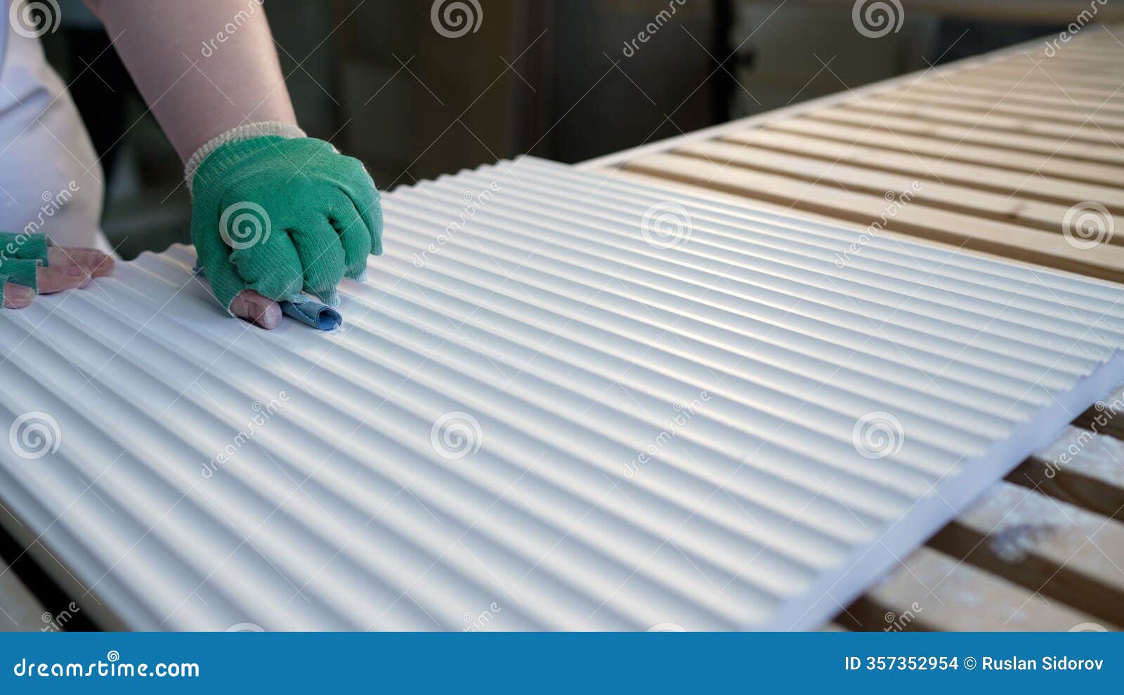 Worker Sanding a White Wooden Panel on a Workbench Stock Photo - Image ...