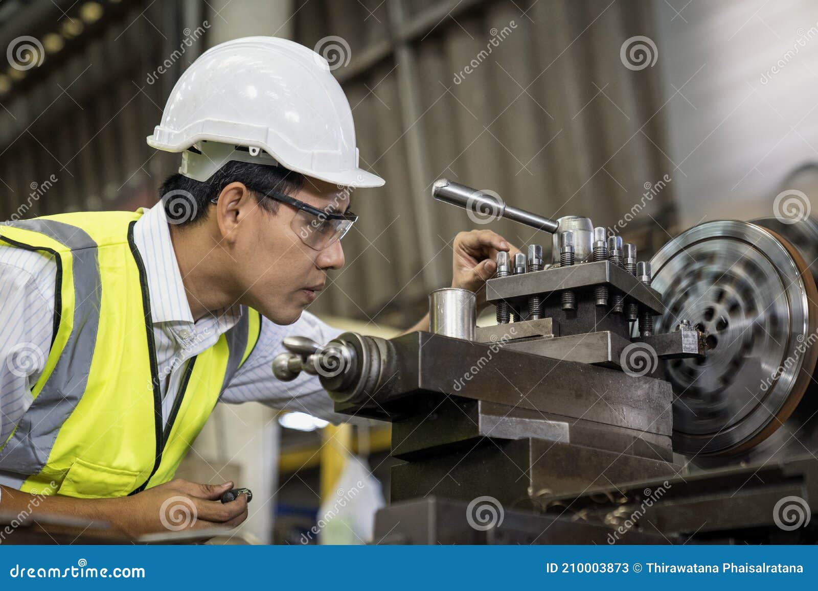 Manufacturing Worker. Asian Mechanical Engineer Operating Industrial ...